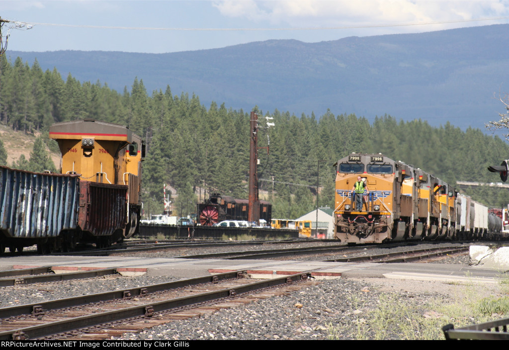 Work train returning to Truckee yard passing stopped westbound freight.